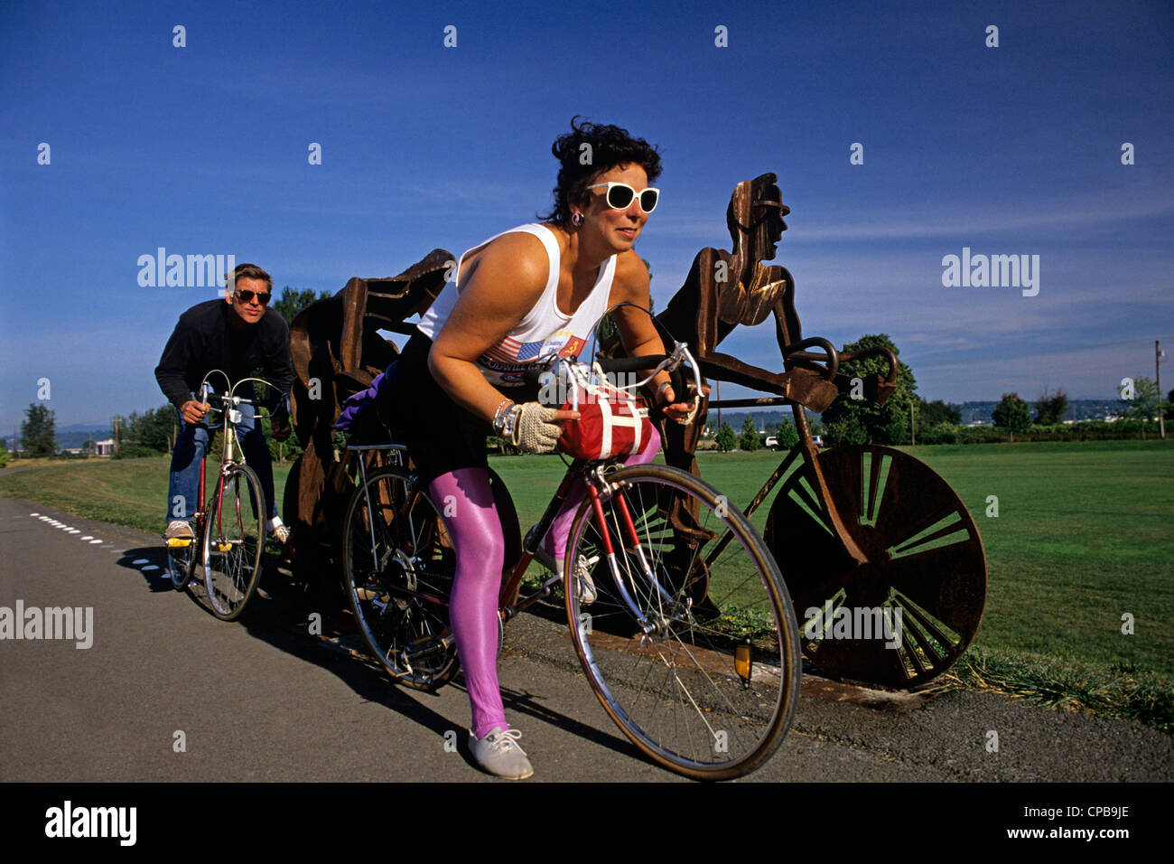 Bicycle riders racing statues of bicycle riders Stock Photo - Alamy