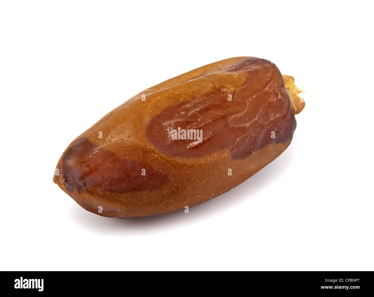 Single sweet date on white background Stock Photo - Alamy