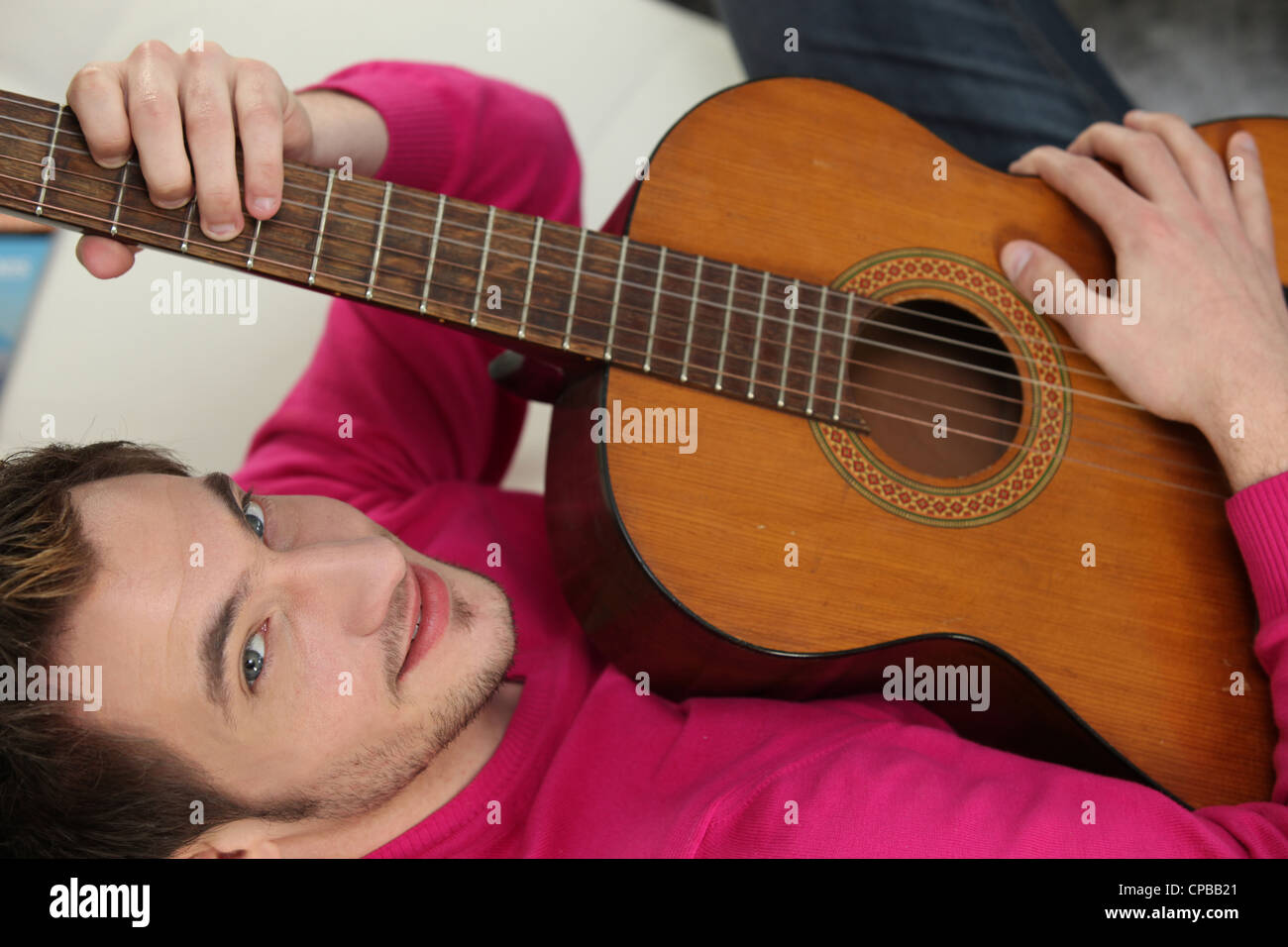 Man playing acoustic guitar Stock Photo - Alamy