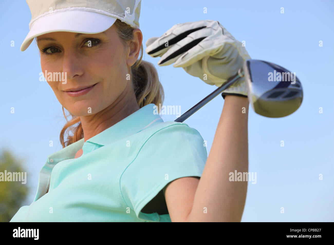 A portrait of a female golfer Stock Photo - Alamy