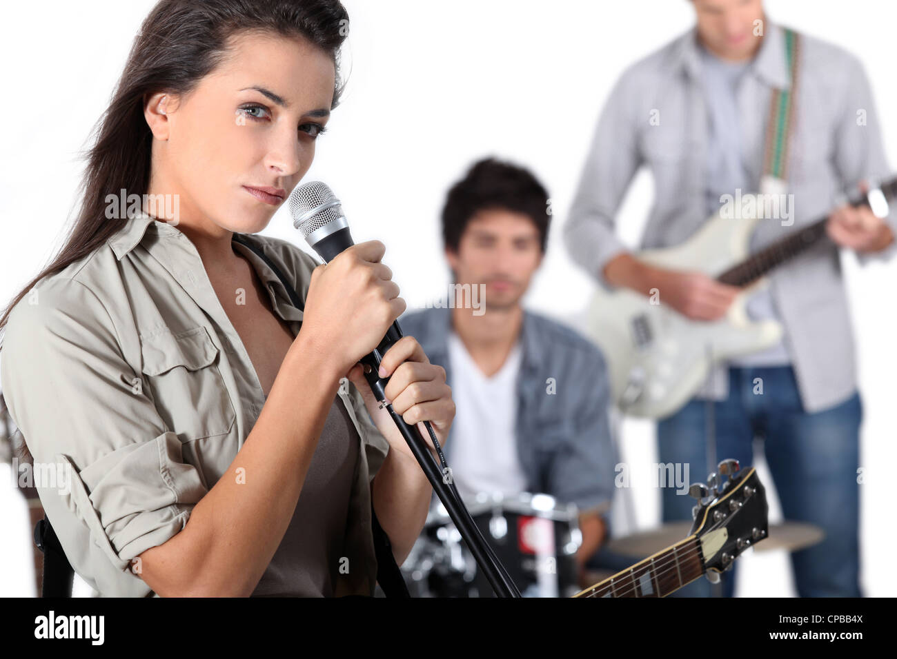 Three people at band practice Stock Photo - Alamy