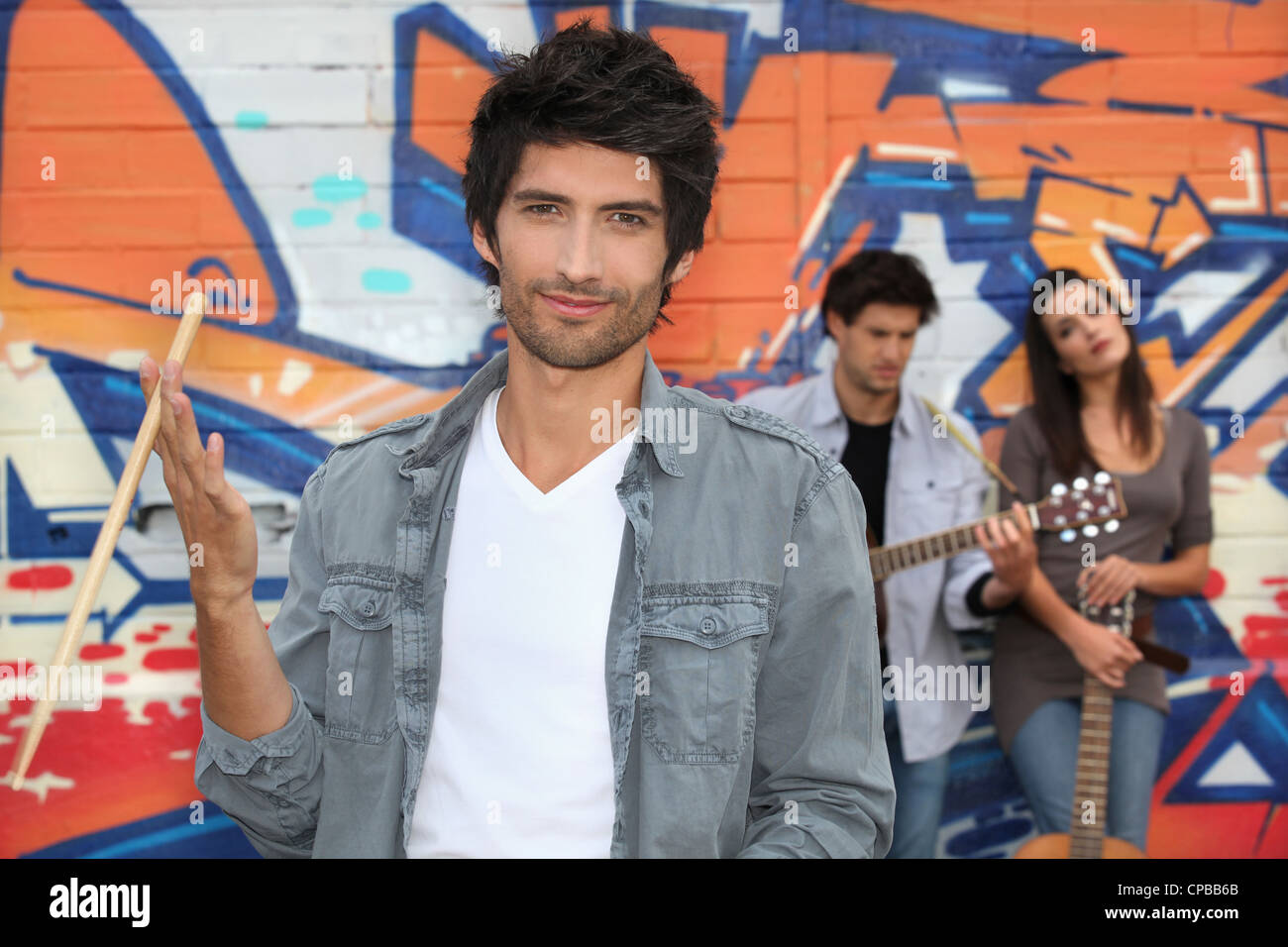 Band in front of painted wall Stock Photo - Alamy