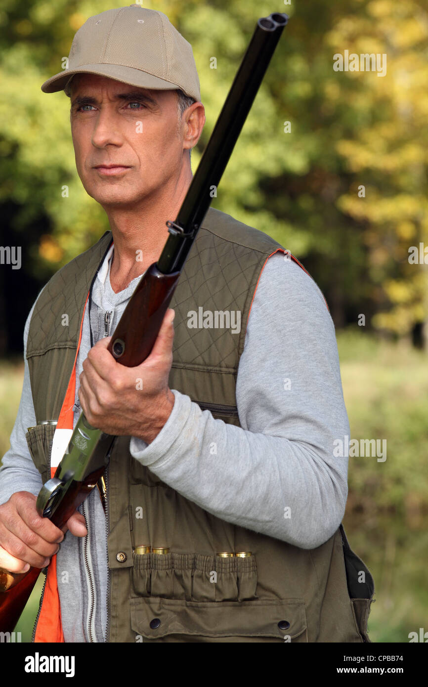 Hunter with rifle Stock Photo - Alamy