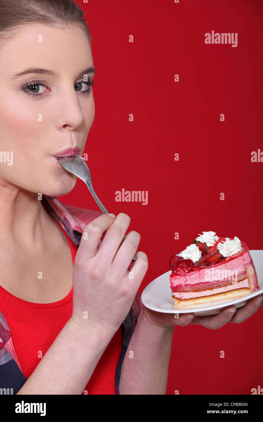 woman eating cake Stock Photo - Alamy