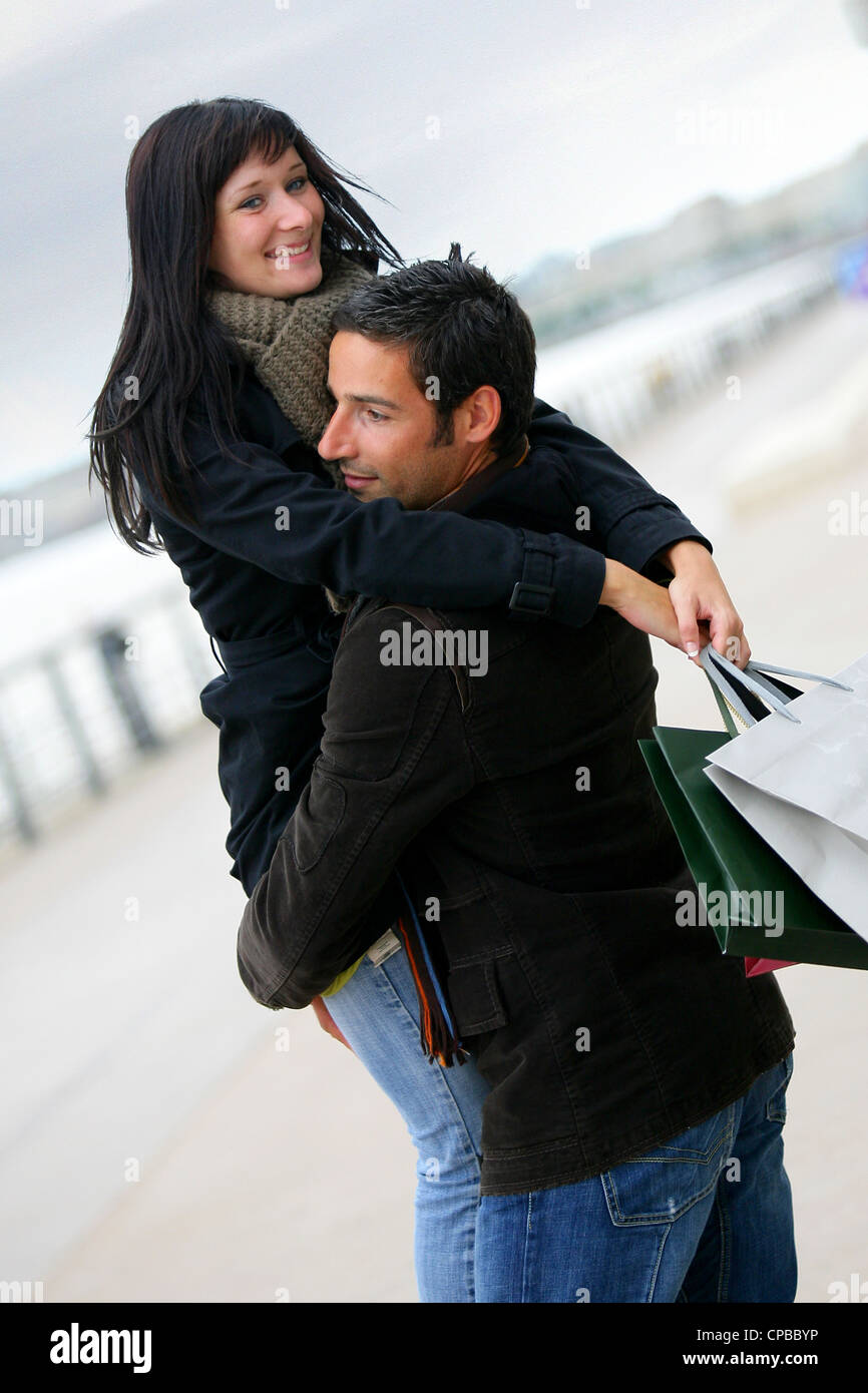 Couple hugging in the street Stock Photo - Alamy