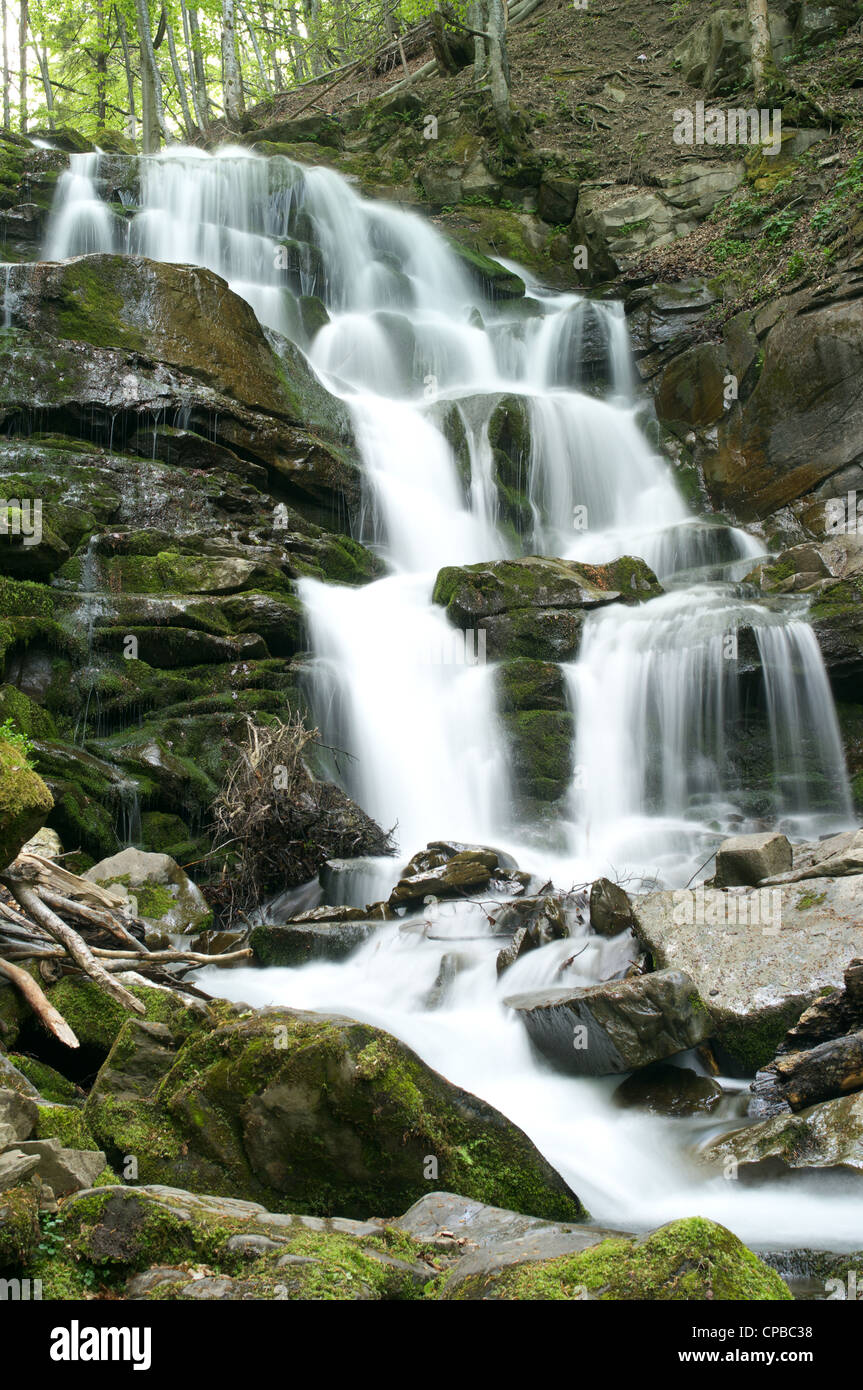 Beautiful waterfall cascades in the mountain forest Stock Photo - Alamy