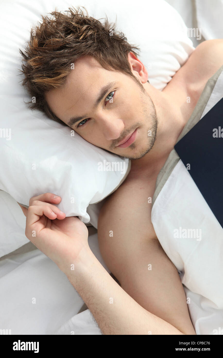Man in bed Stock Photo - Alamy