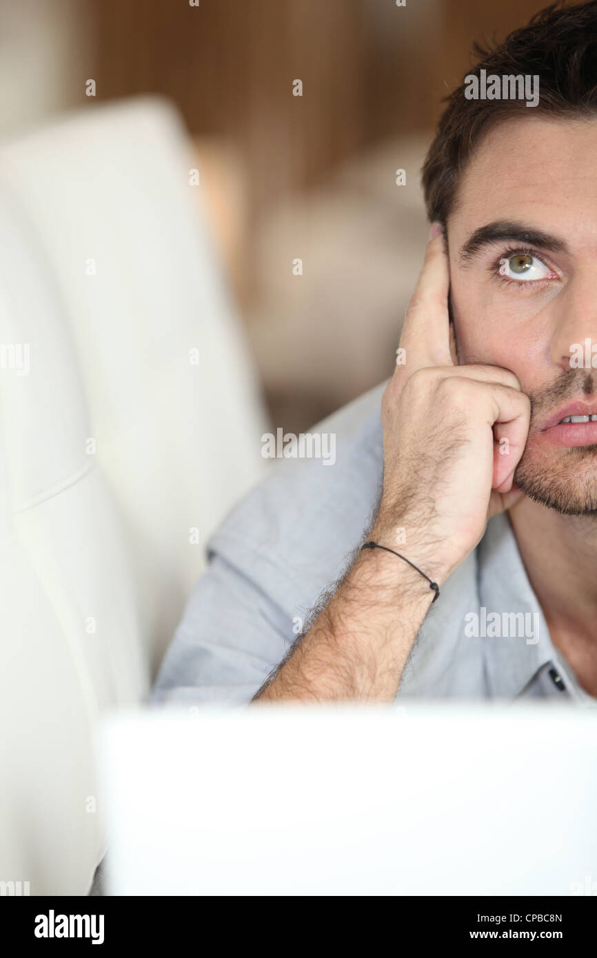 Man using his laptop Stock Photo - Alamy