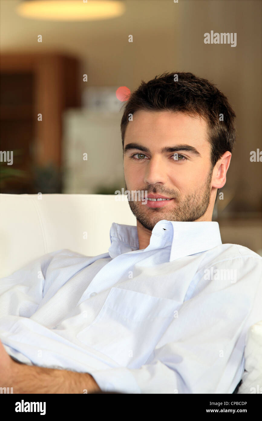 Man relaxing at home Stock Photo - Alamy