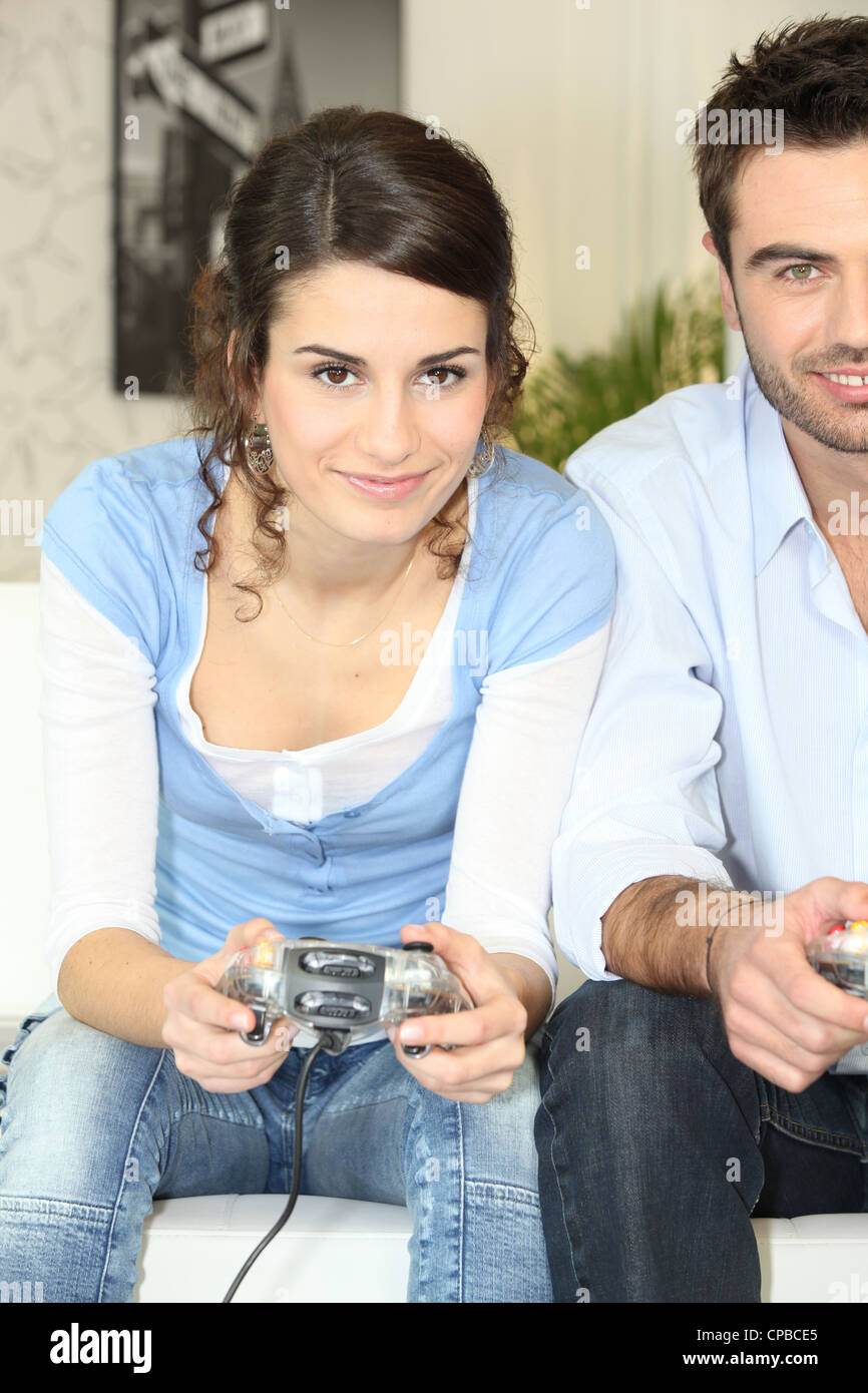 Couple playing video games Stock Photo - Alamy