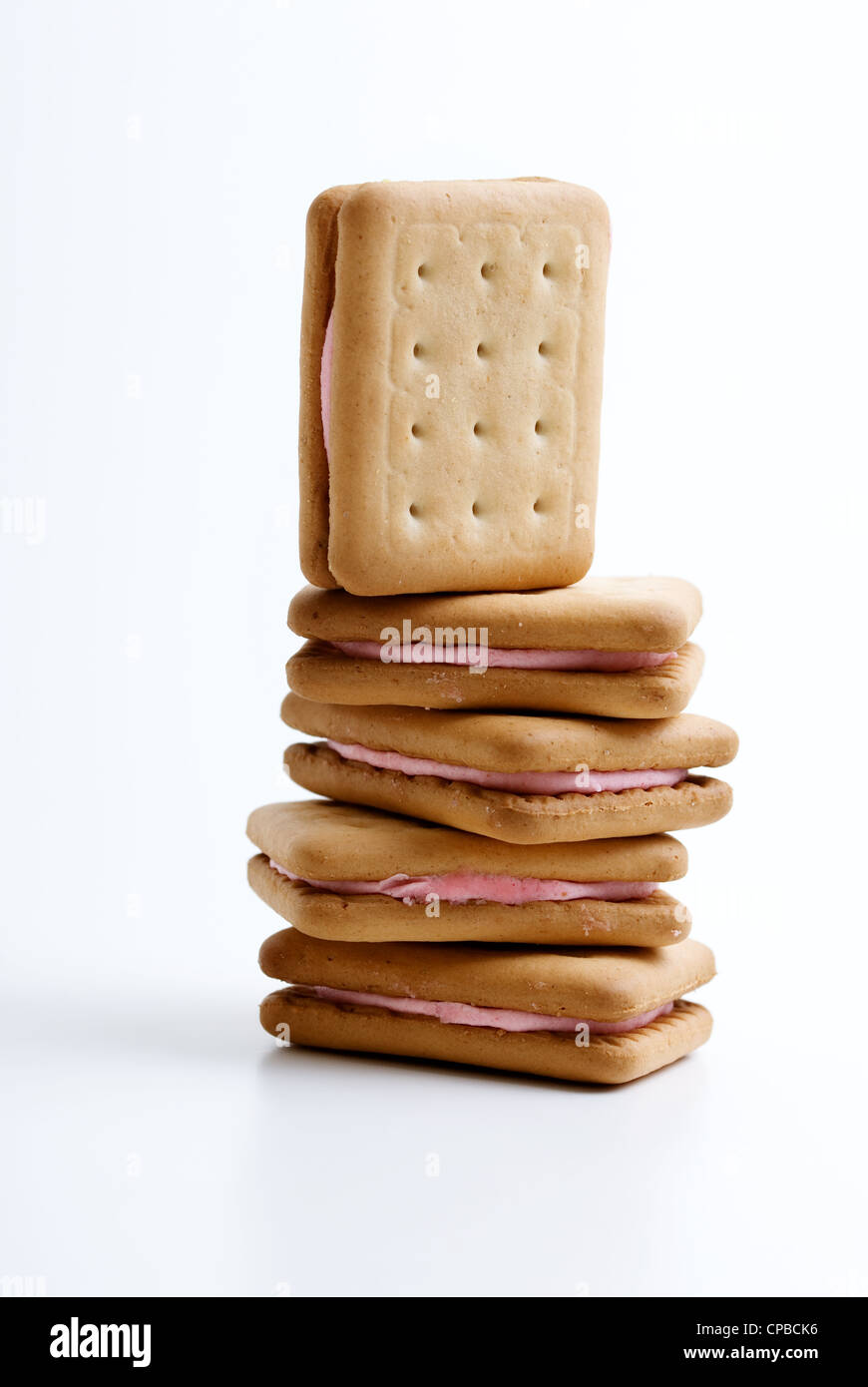 A pile of biscuits or cookies with a creamy strawberry filling Stock ...