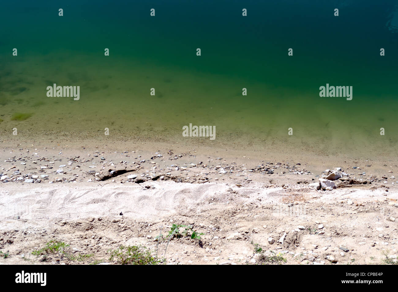 Shore of the lake close as background Stock Photo - Alamy