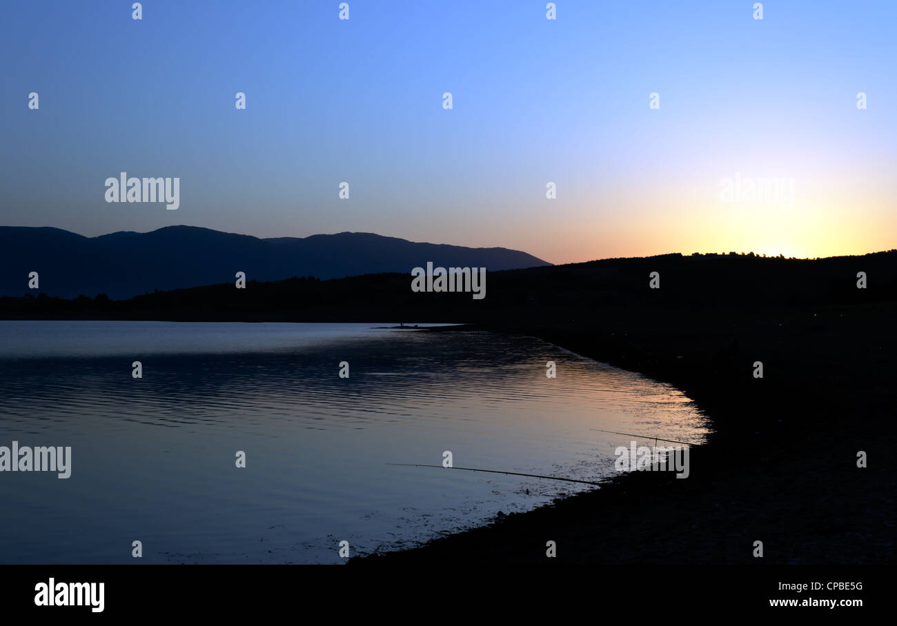 Morning lake landscape with sunrise over mountains Stock Photo - Alamy