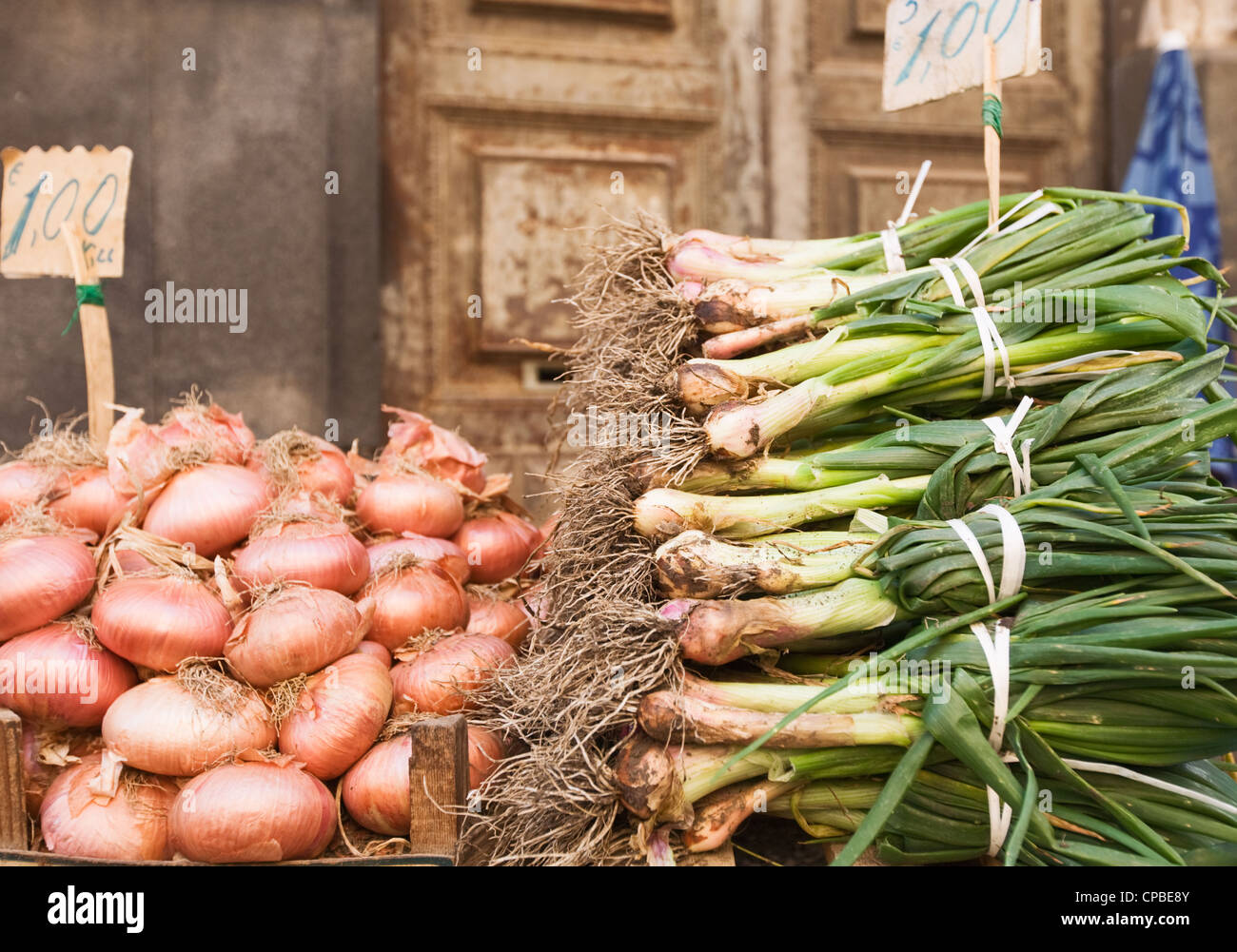 Onion and green shallots at a market stall, Catania, Sicily, Italy ...
