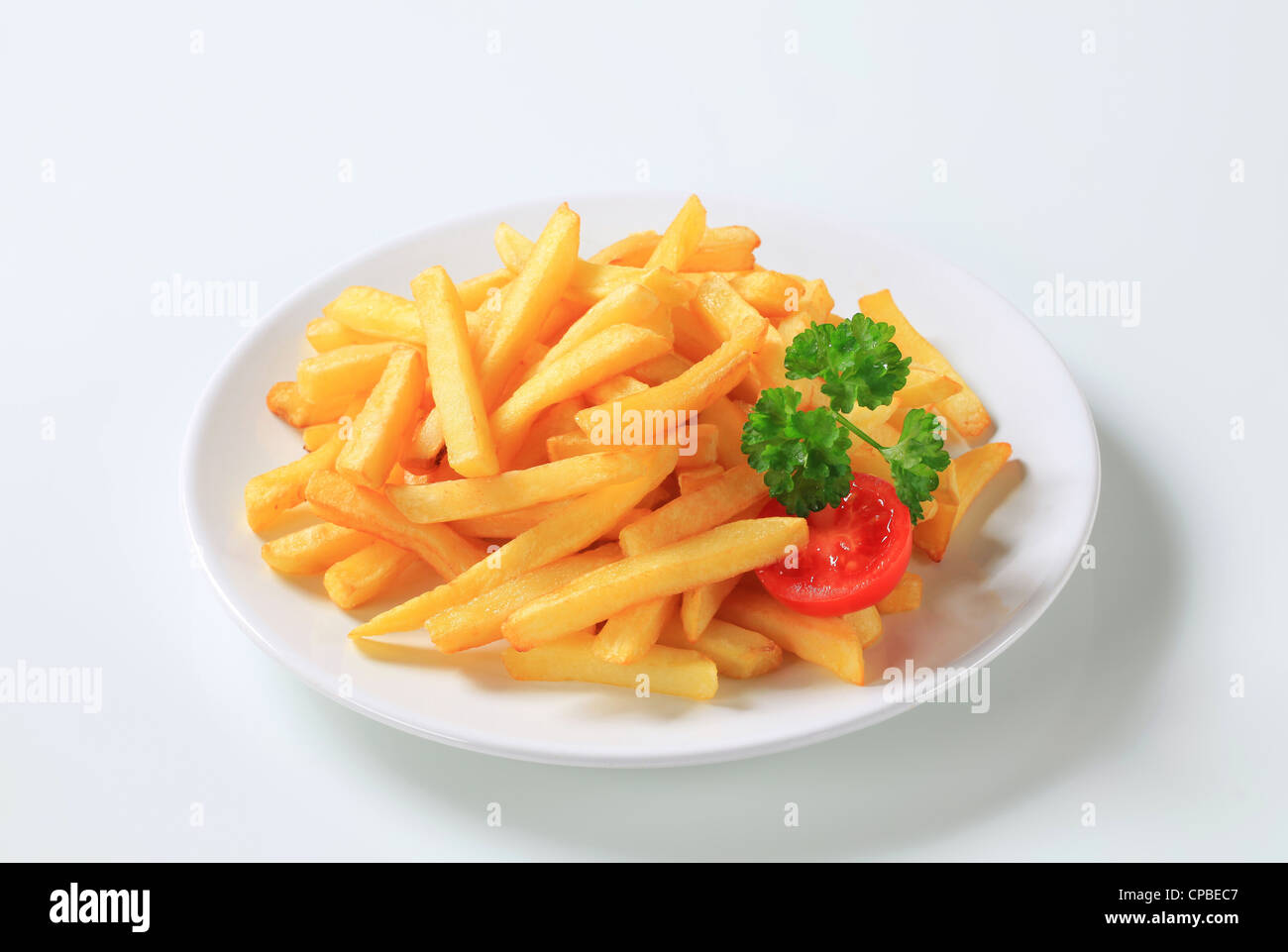 Serving of French fries on a plate Stock Photo - Alamy