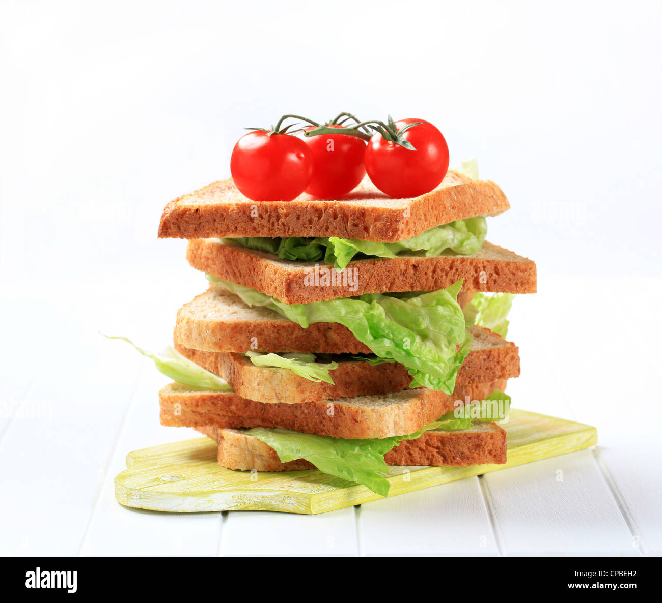 Pile of sliced sandwich bread with lettuce Stock Photo - Alamy