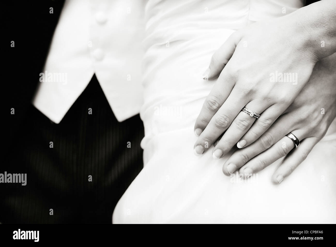 Bride and Groom displaying their wedding rings, with their hands ...