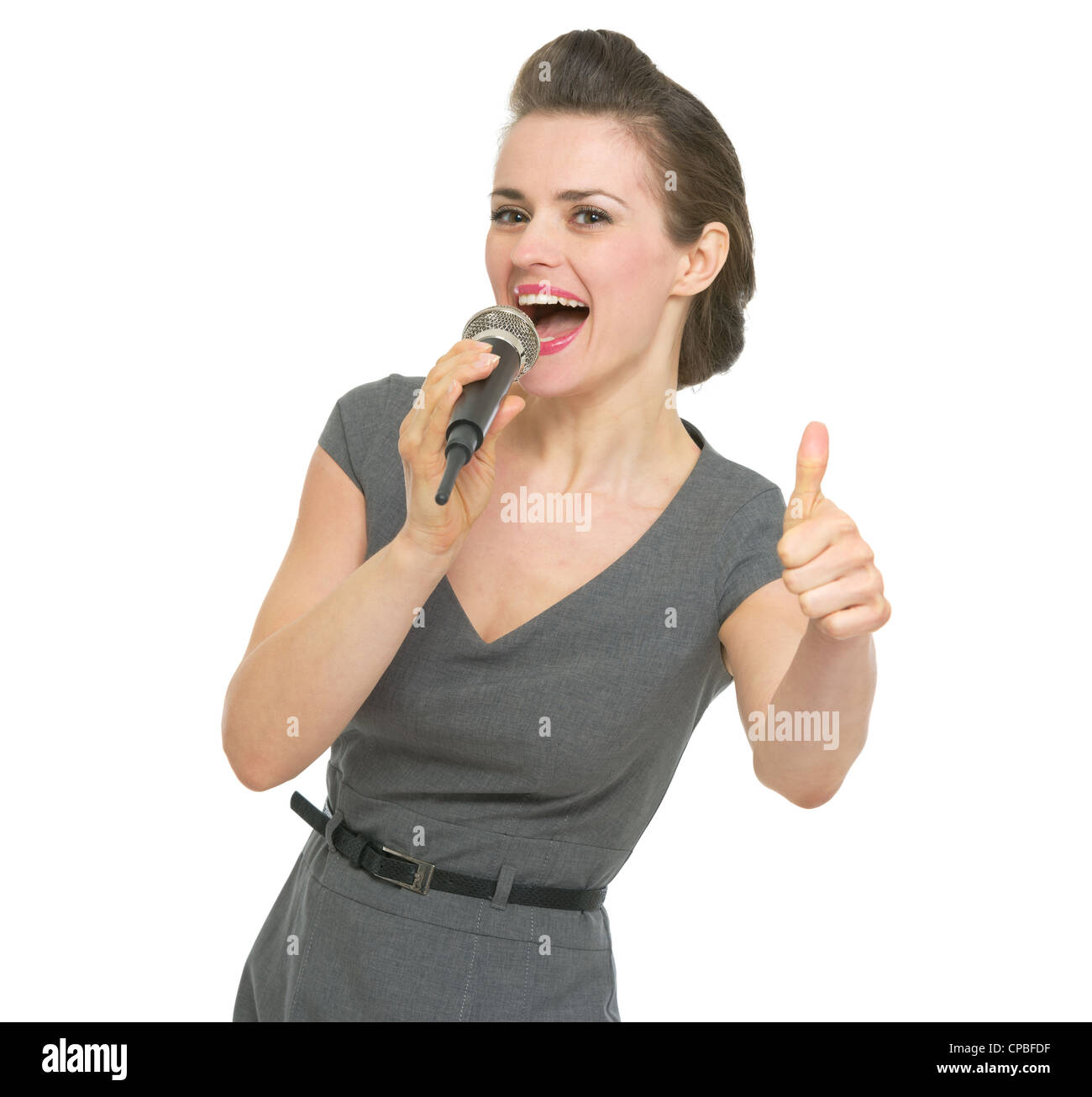 Singing in microphone woman showing thumbs up Stock Photo - Alamy