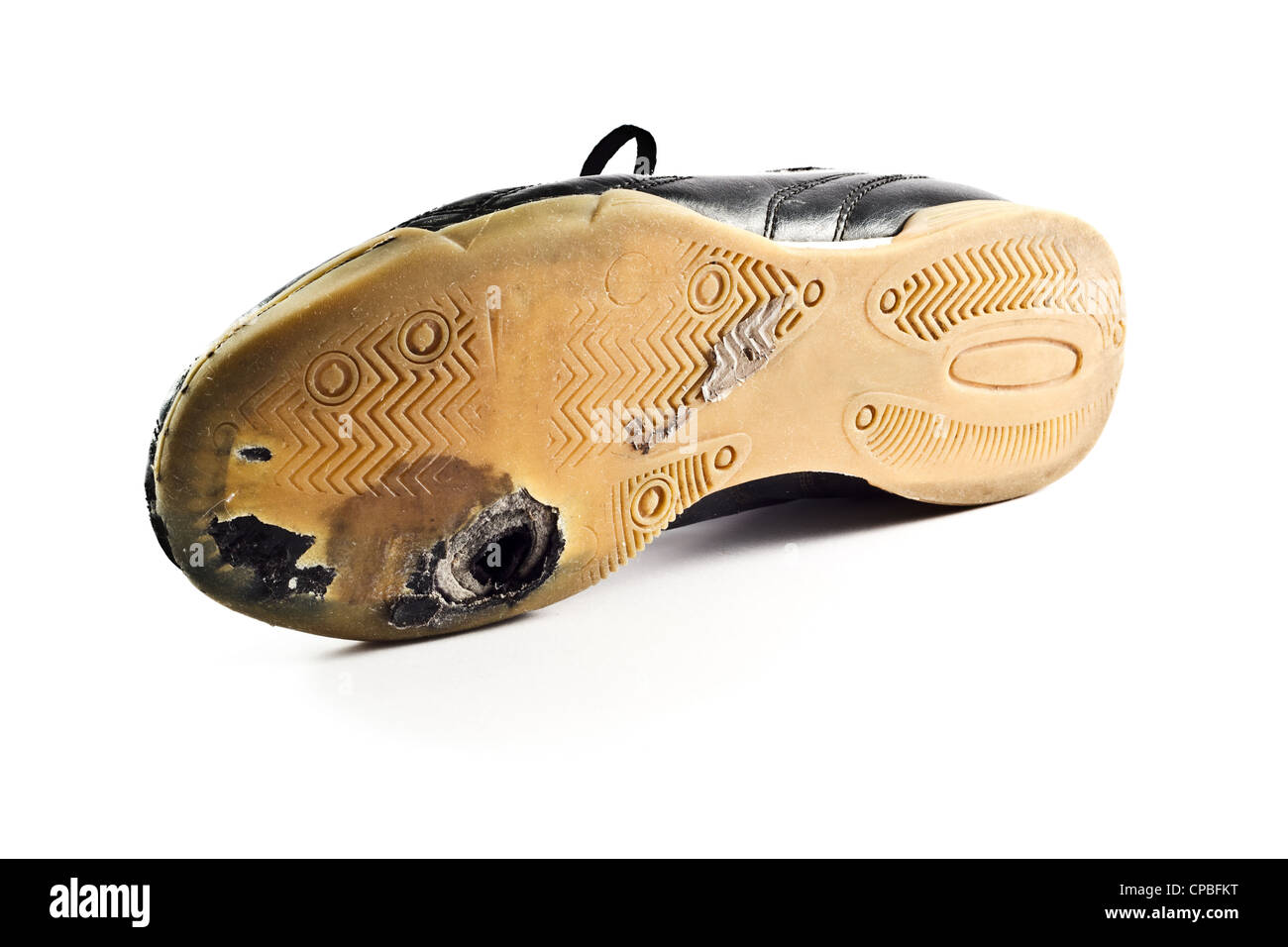 Worn out sports Shoe with hole on bottom, white background Stock Photo ...