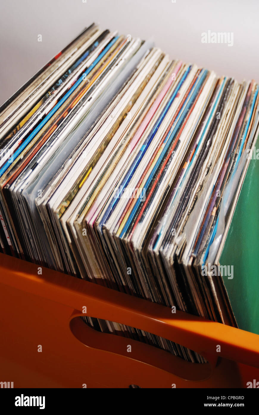 lot of records in orange plastic box Stock Photo - Alamy
