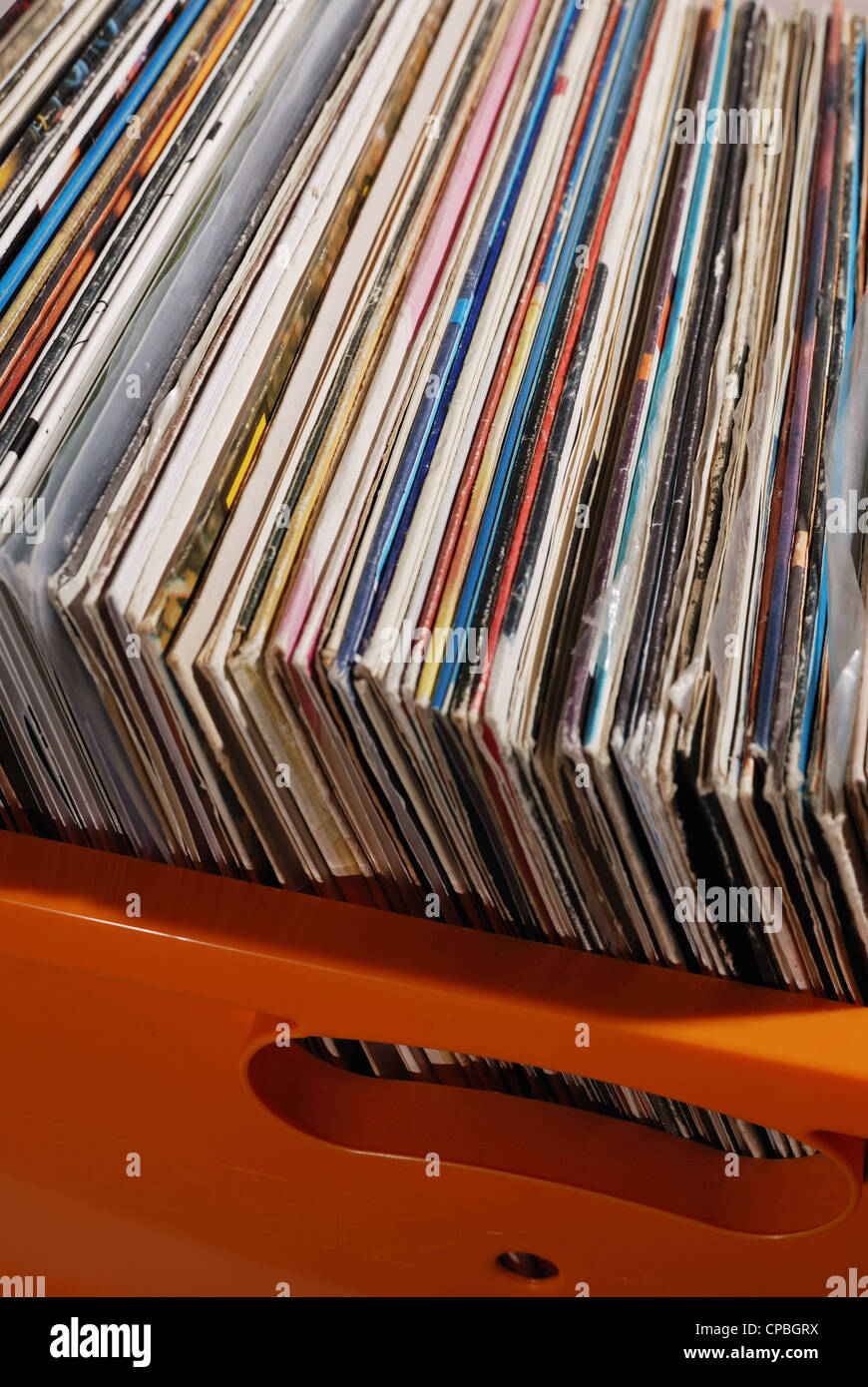 lot of records in orange plastic box Stock Photo - Alamy