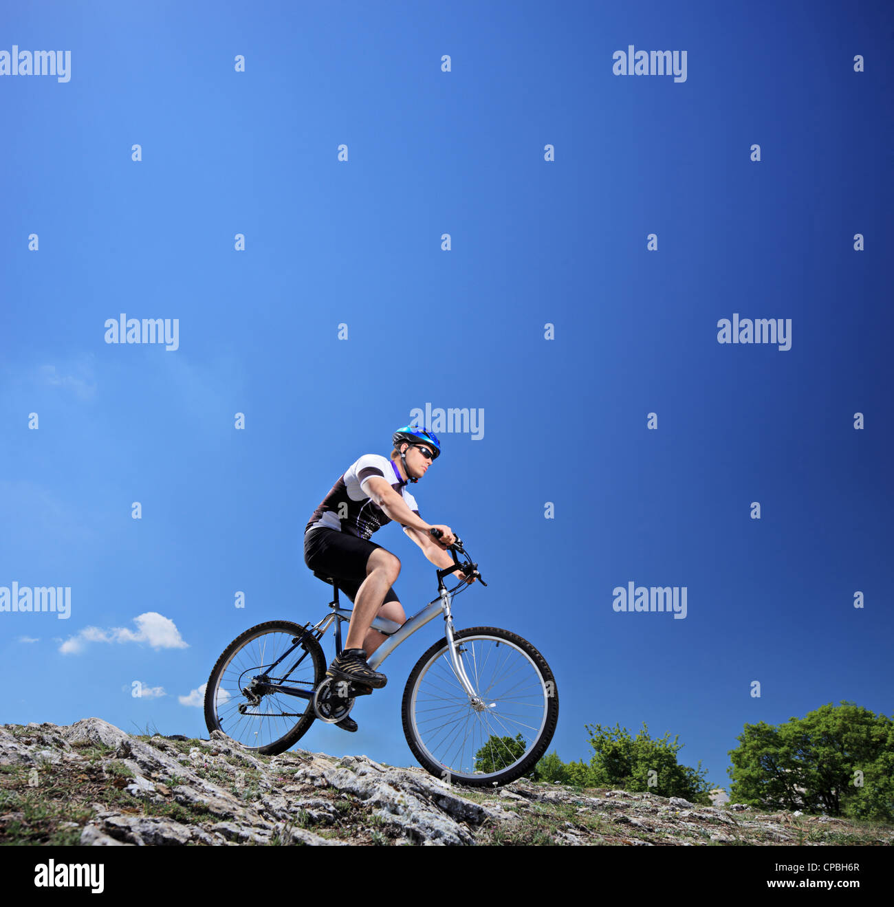 A man riding a mountain bike on a slope, Macedonia Stock Photo - Alamy