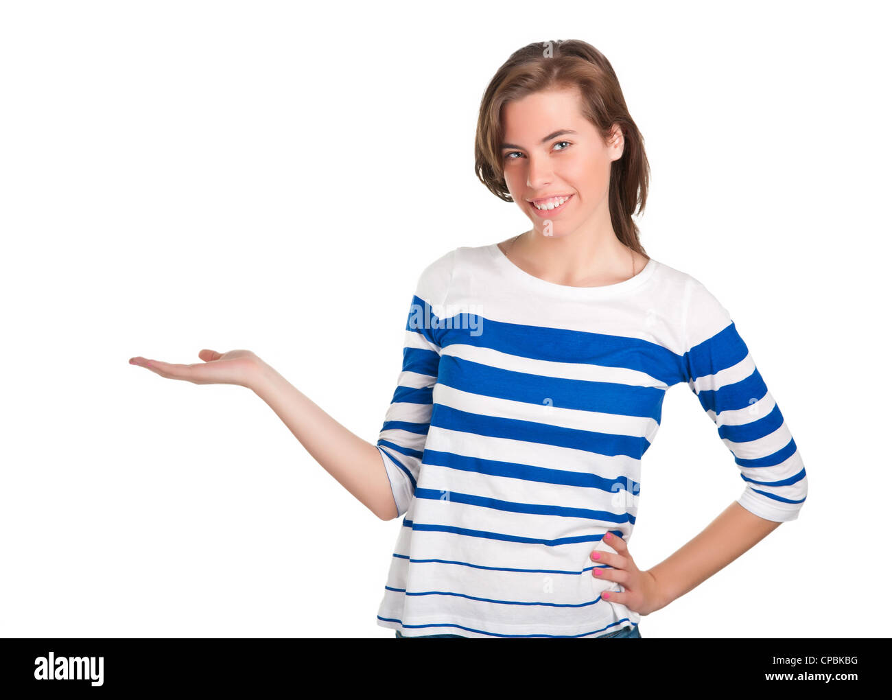 Young woman standing with her hand outstretched, as though she is ...