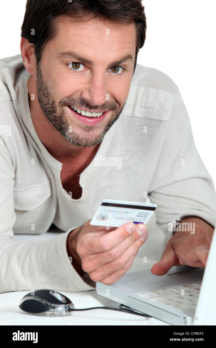 Man shopping online Stock Photo - Alamy