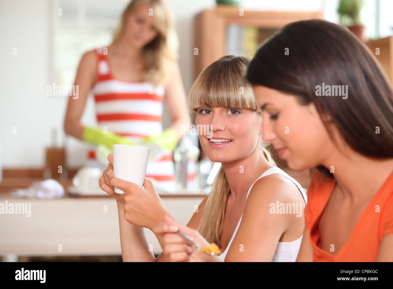 Girls having breakfast Stock Photo - Alamy