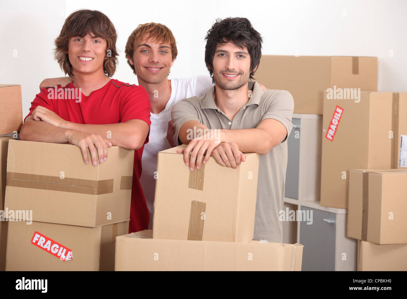 Young men on moving day Stock Photo - Alamy