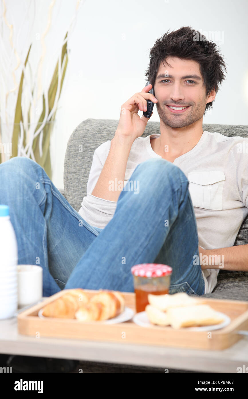 Eating breakfast on the sofa Stock Photo - Alamy