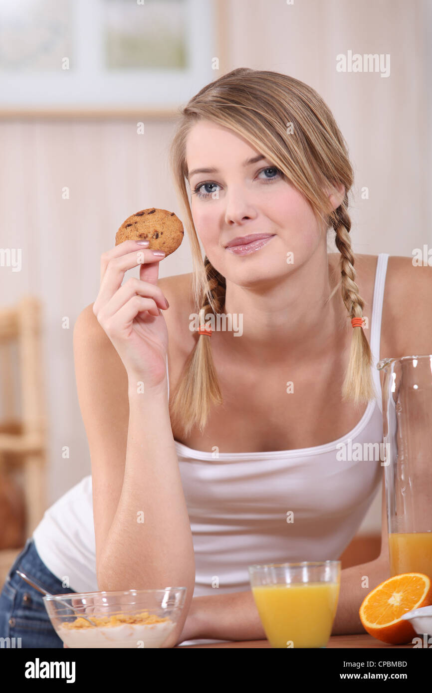 Woman eating a well balanced breakfast hi-res stock photography and ...