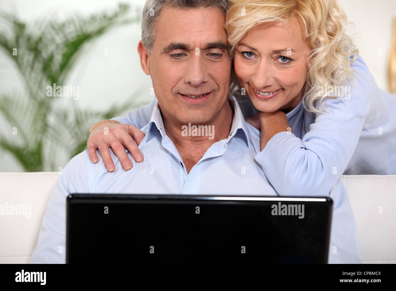 Married couple surfing the Internet together Stock Photo - Alamy