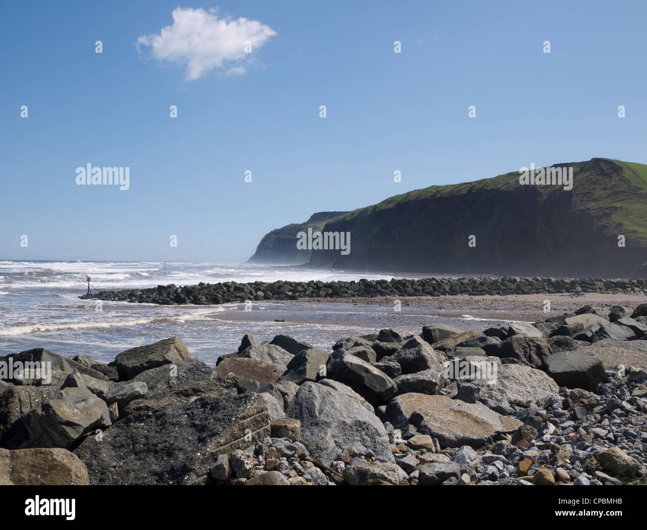 The entrance to the little harbour at Skinningrove with spring sunshine ...