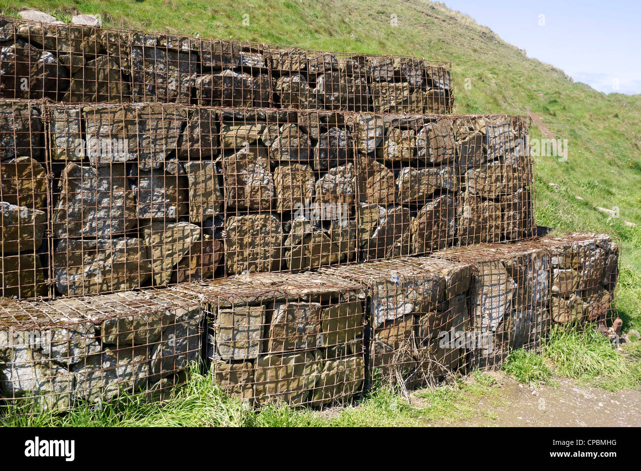Rock filled welded steel mesh gabions used to stabilise the toe of a ...