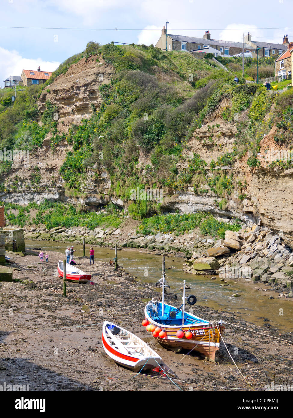 Fishing boats in Roxby Beck Staithes North Yorkshire in ispring Stock ...