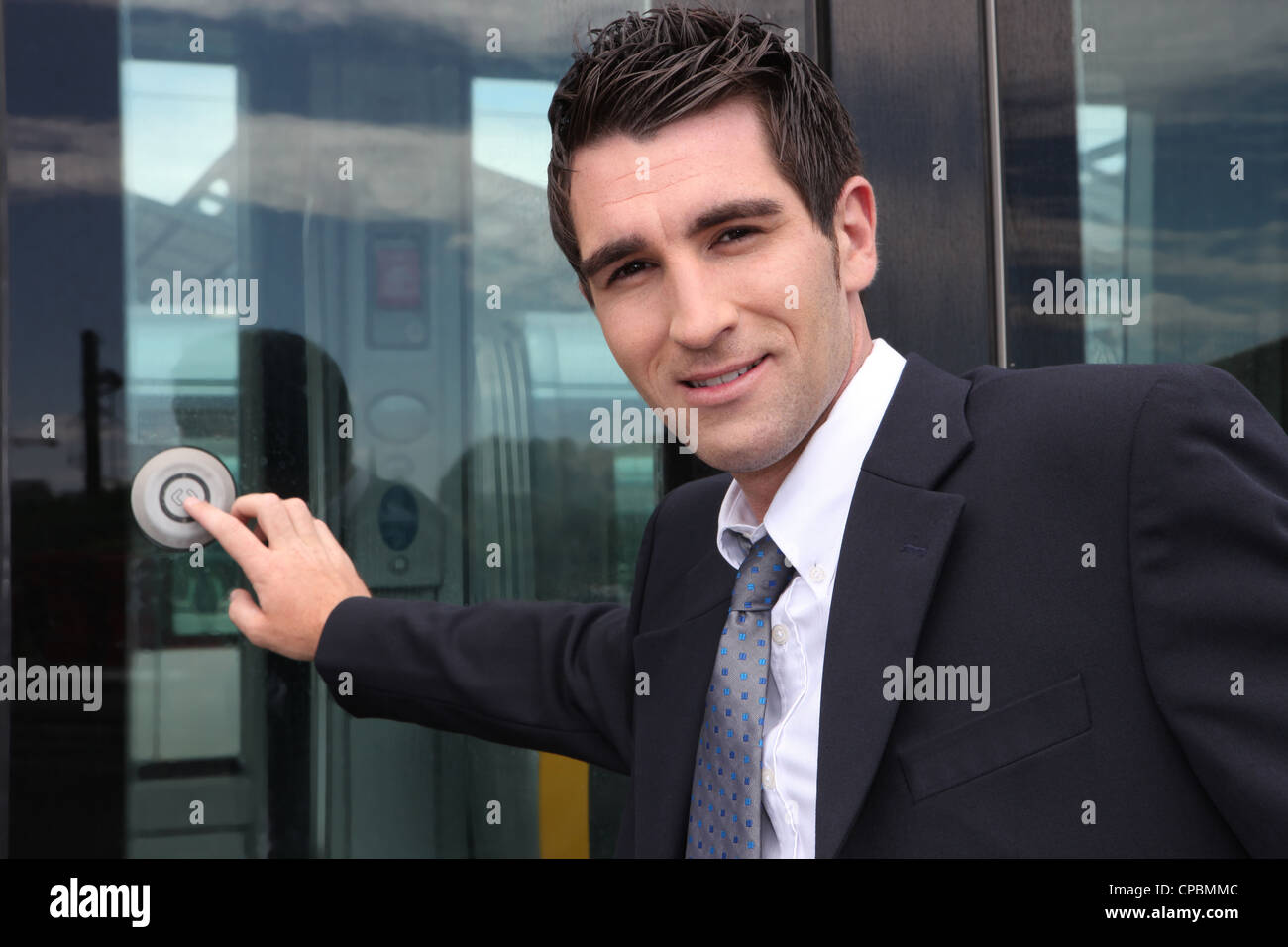 Man getting onto tram Stock Photo - Alamy