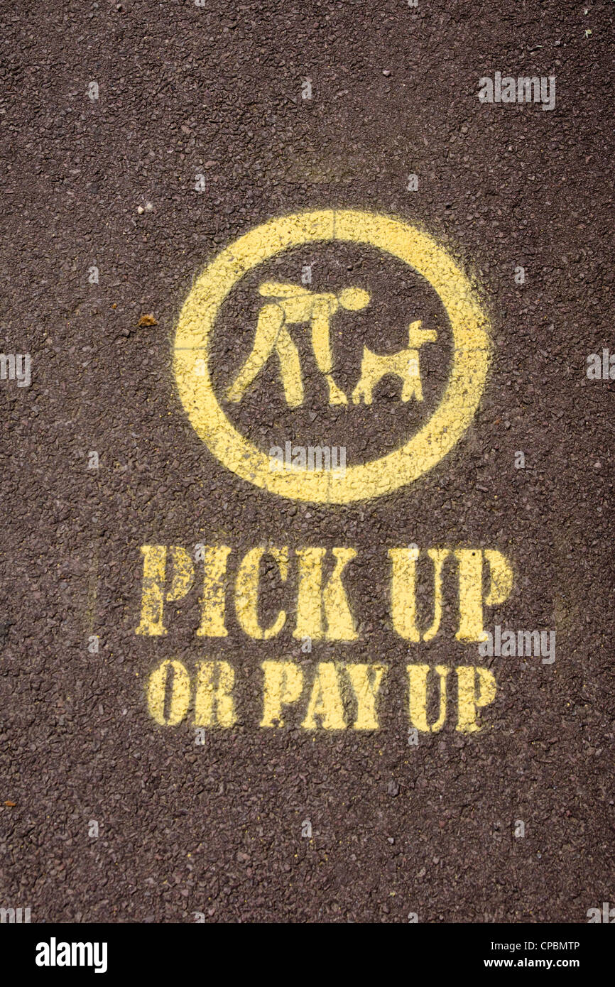 Pick Up or Pay Up sign Stock Photo - Alamy