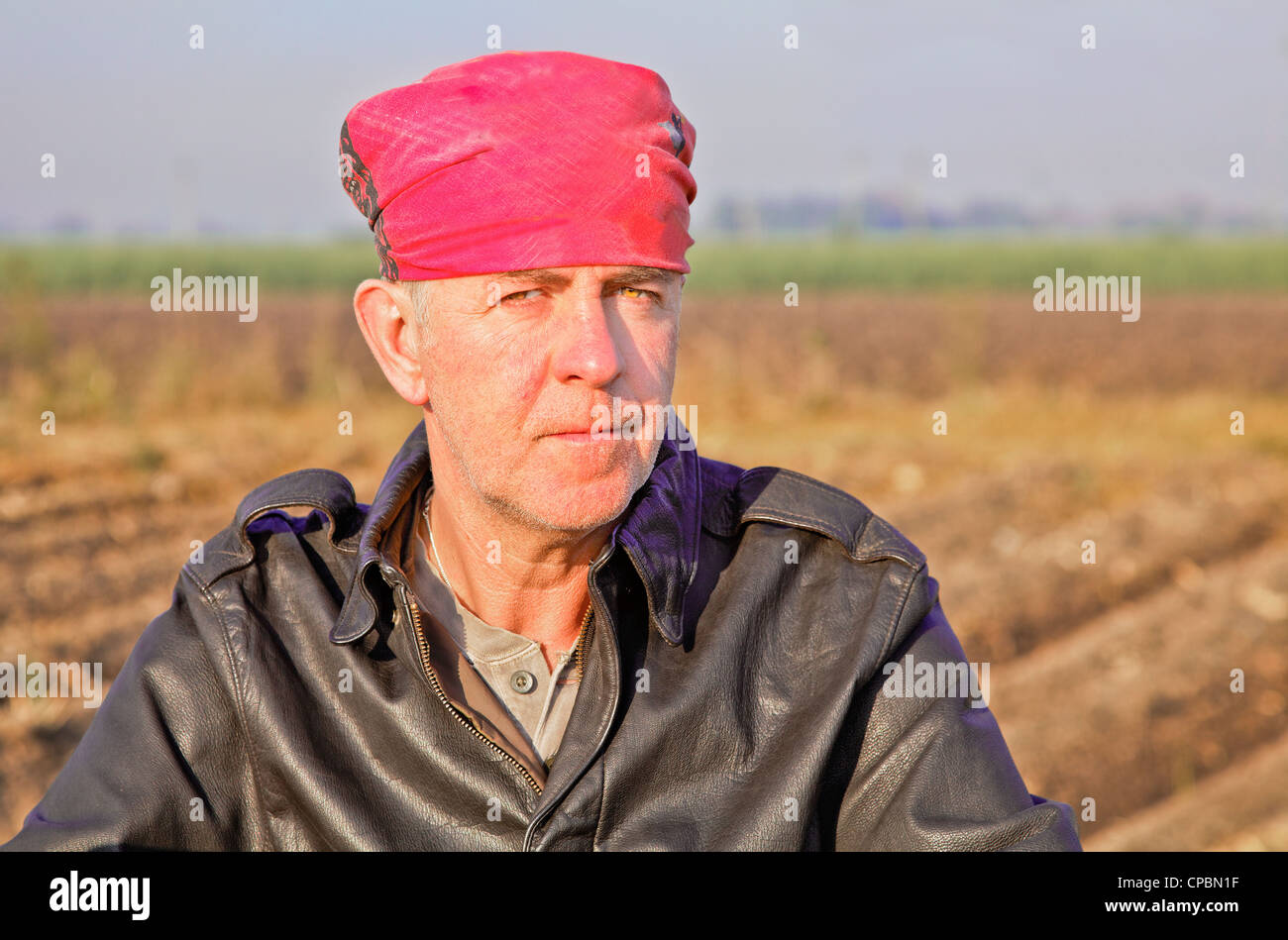 Landscape portrait of stern faced Caucasian with bandanna in a USAAF ...