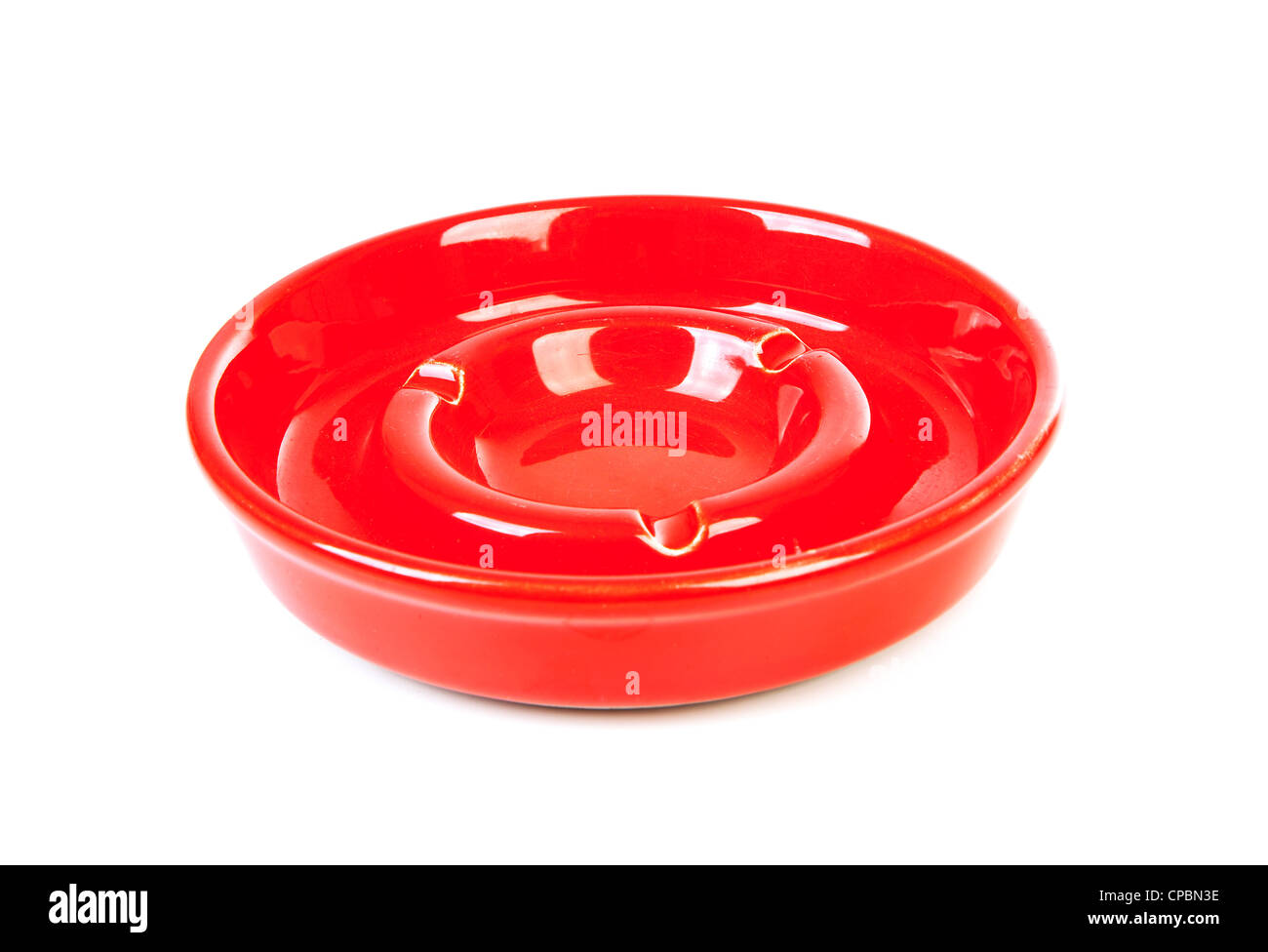 One empty red ashtray over white background Stock Photo - Alamy