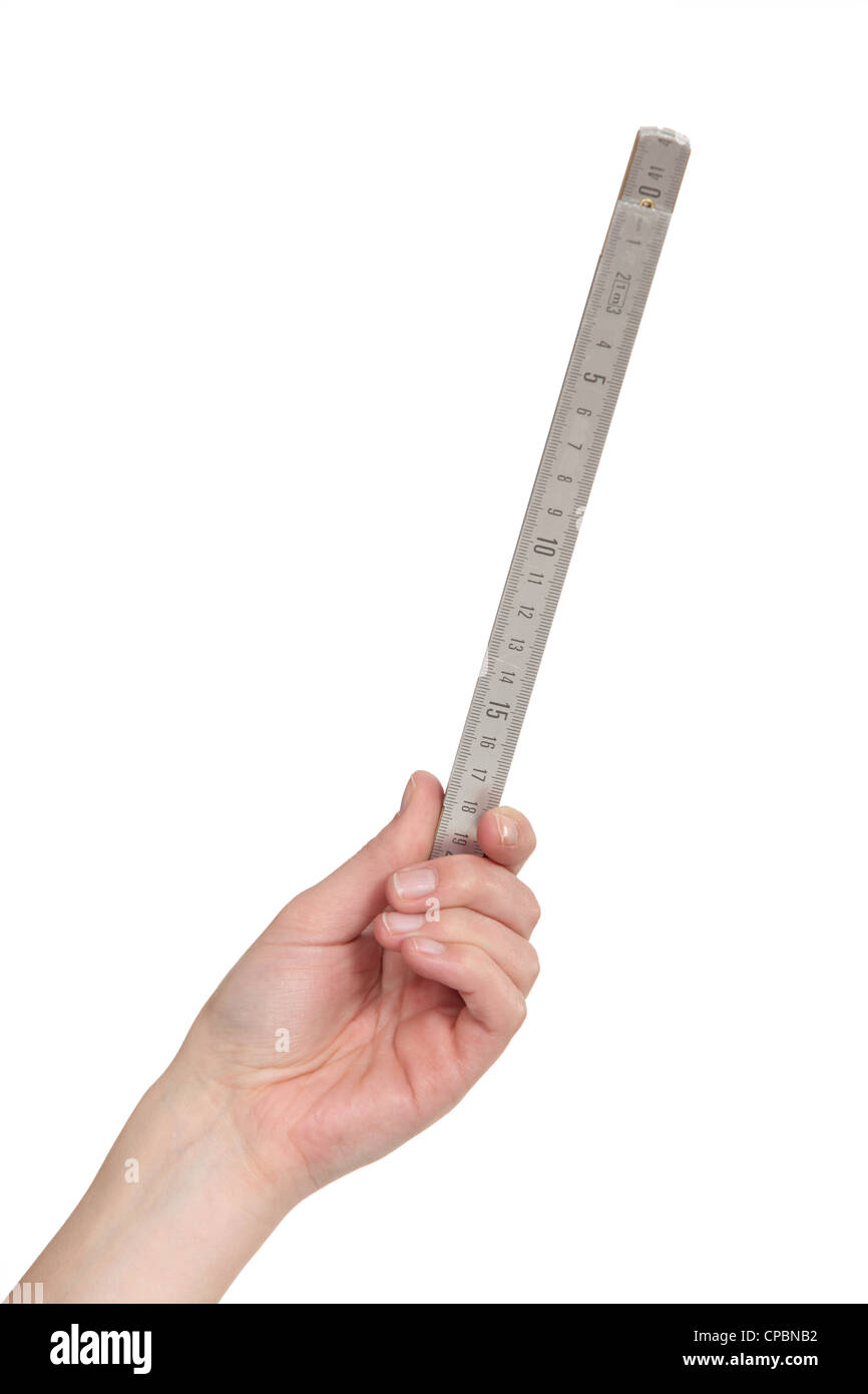 Female hand holding a ruler Stock Photo - Alamy