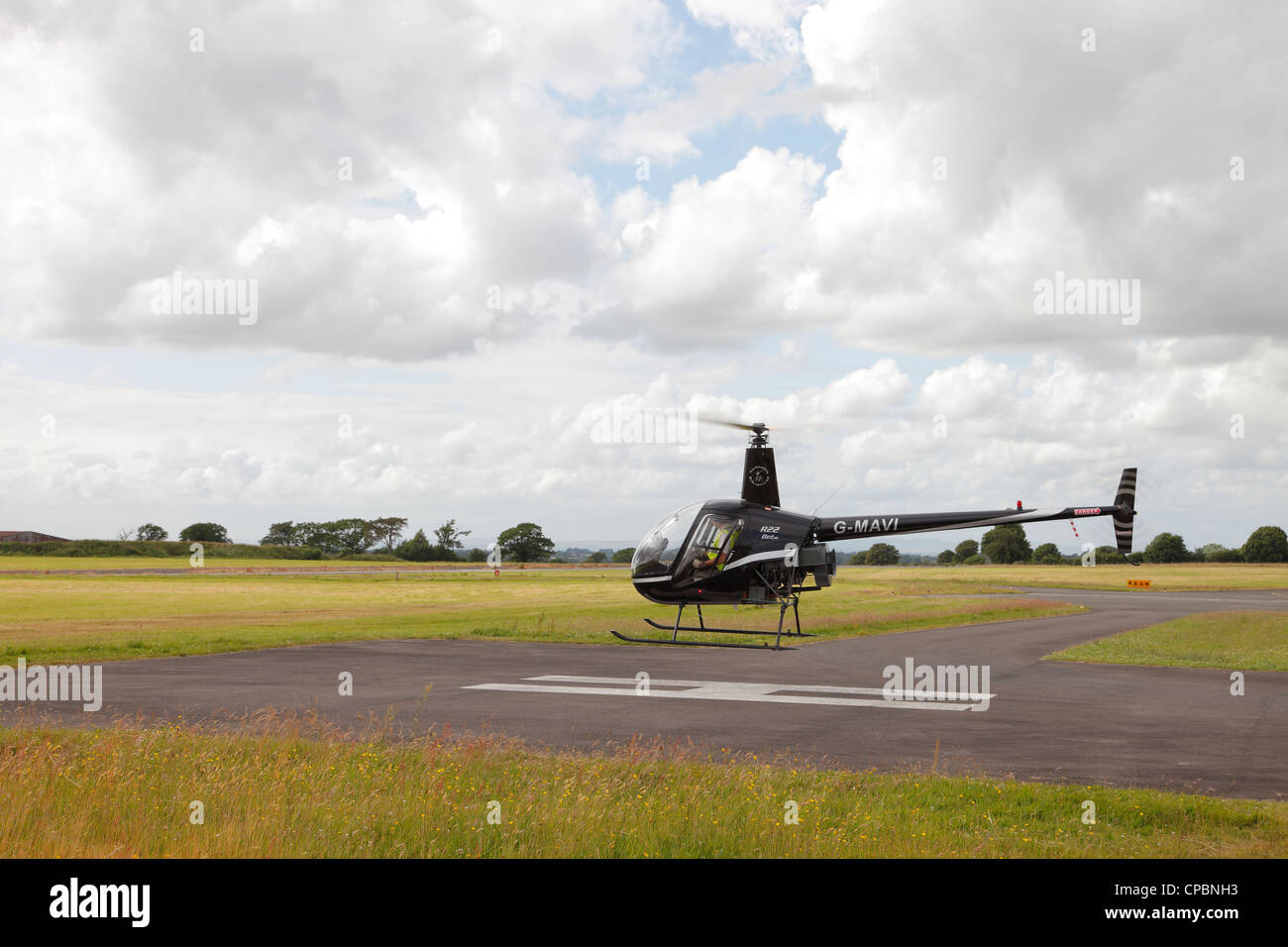 Robinson R22 Beta light utility helicopter landing at Carlisle Airport ...