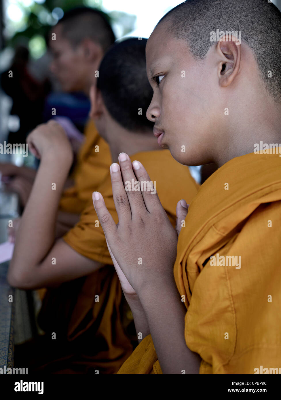 Boy Buddhist monk praying. Thailand Asia Stock Photo - Alamy