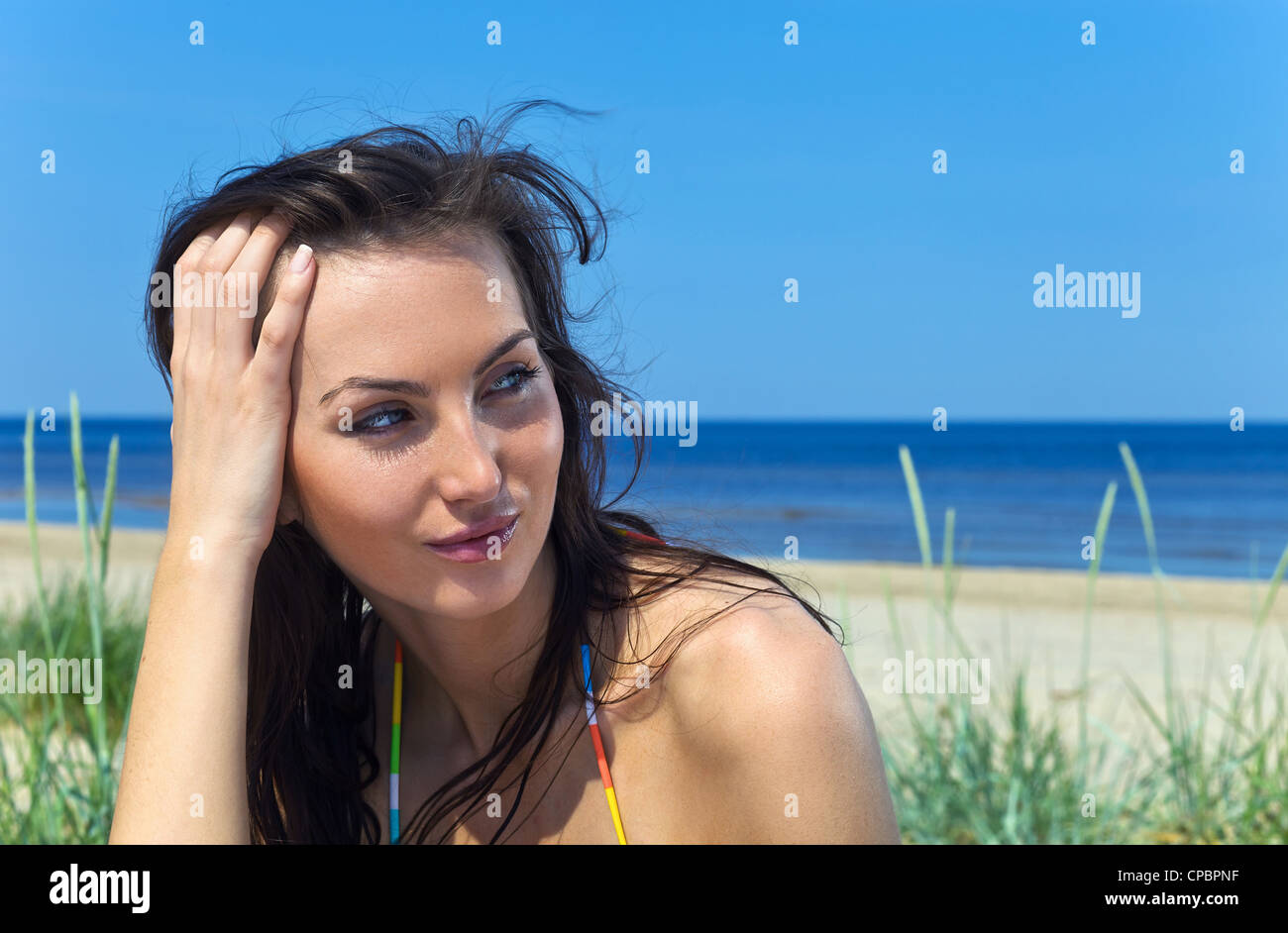 Woman sunbathe beach hi-res stock photography and images - Alamy