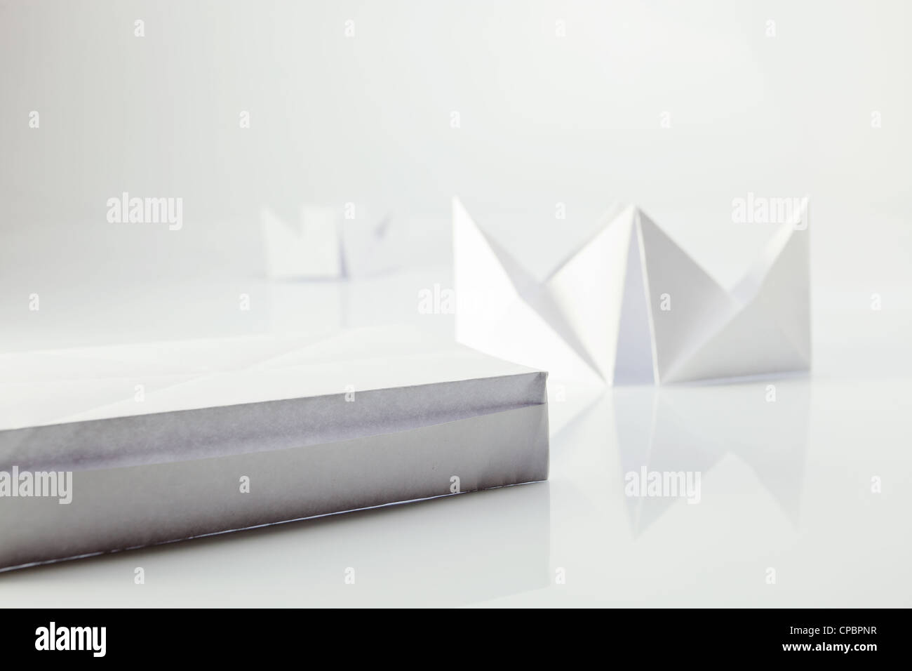 origami , figures from white paper on a white background Stock Photo ...