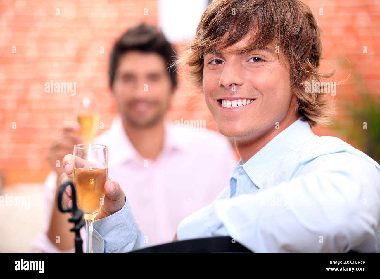 Men drinking champagne in a restaurant Stock Photo - Alamy