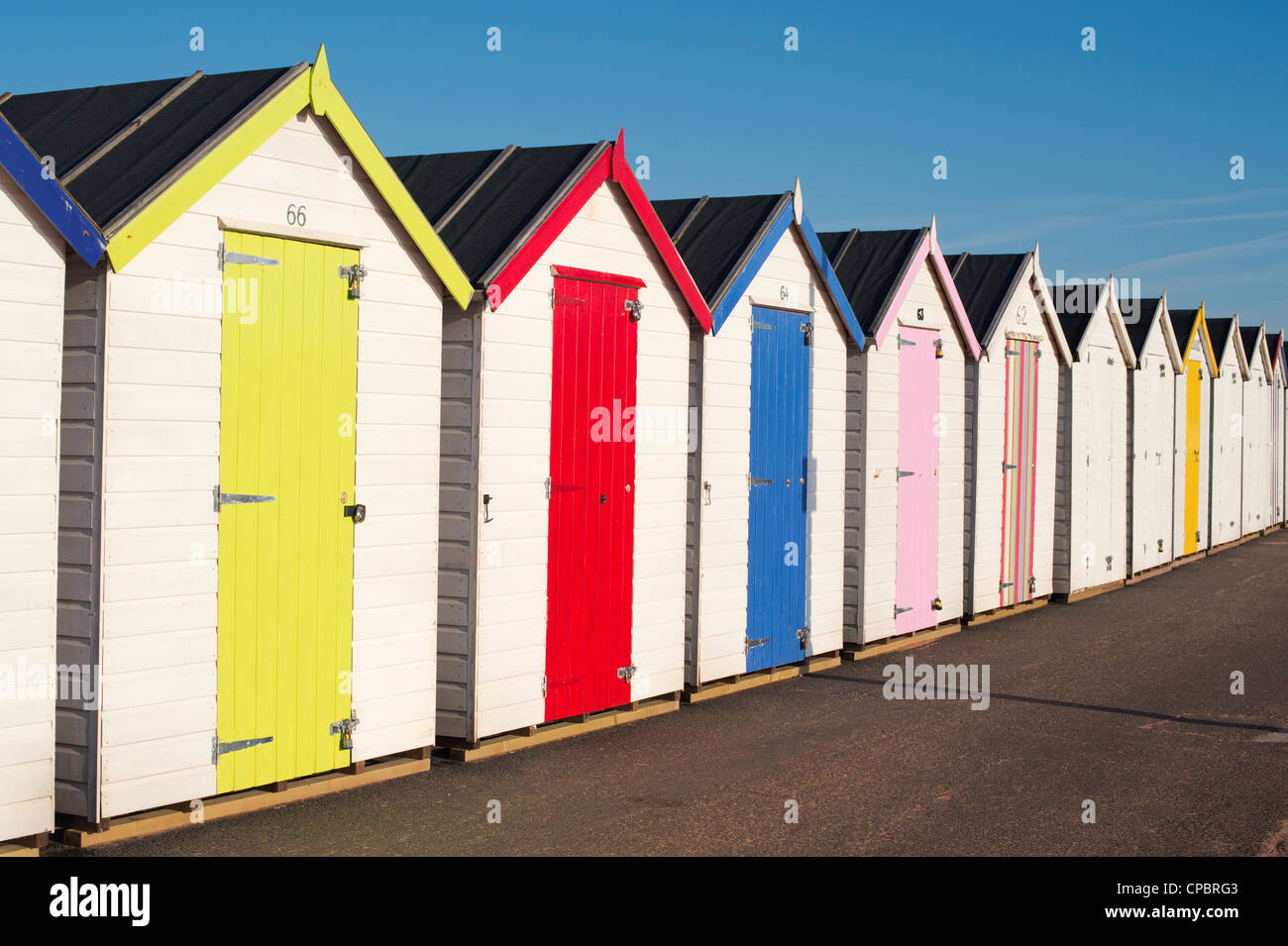 Colourful beach huts against blue sky. Goodrington, Paignton, Devon ...