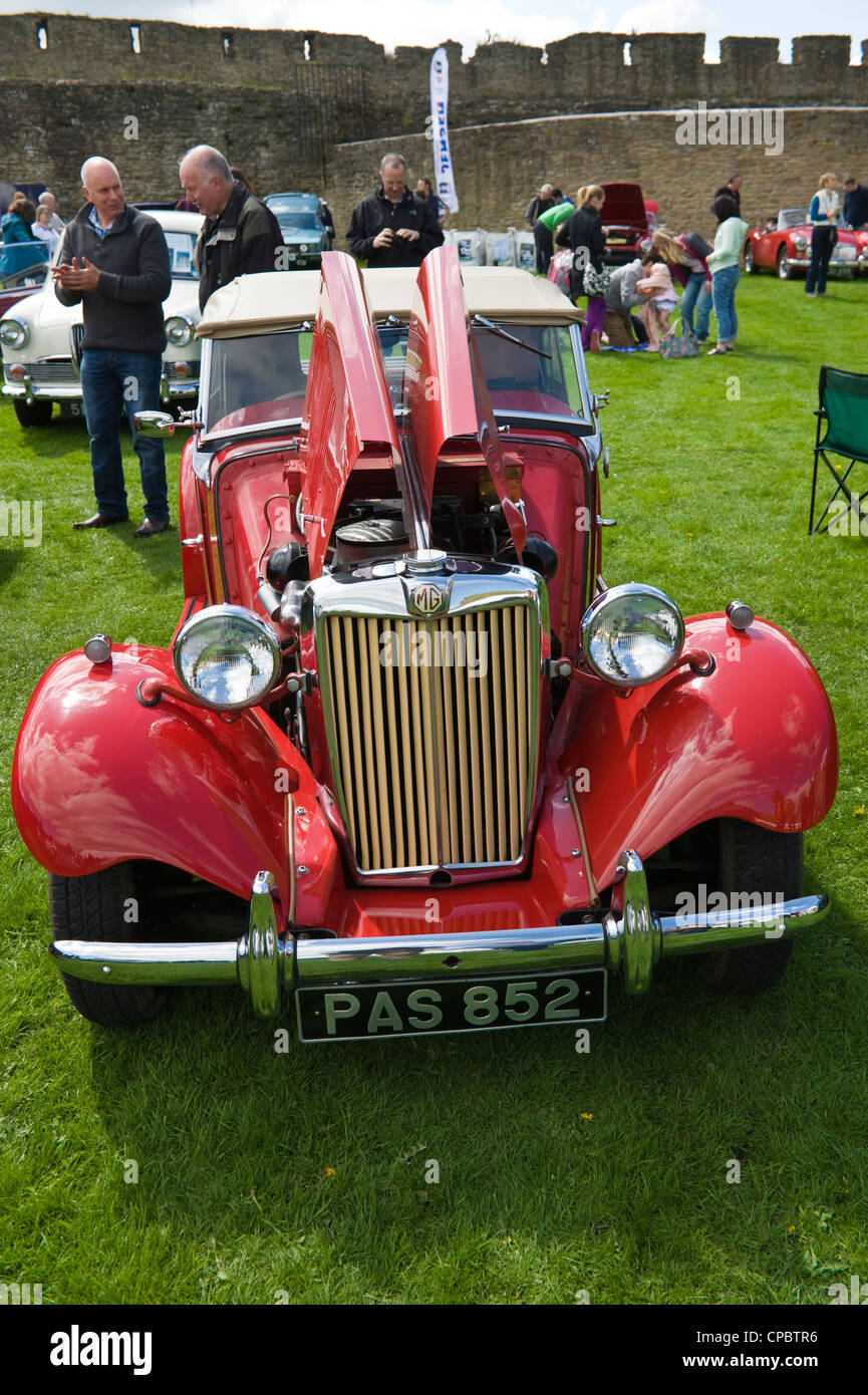 Vintage classic red MG convertible sports car on display at the Marches ...