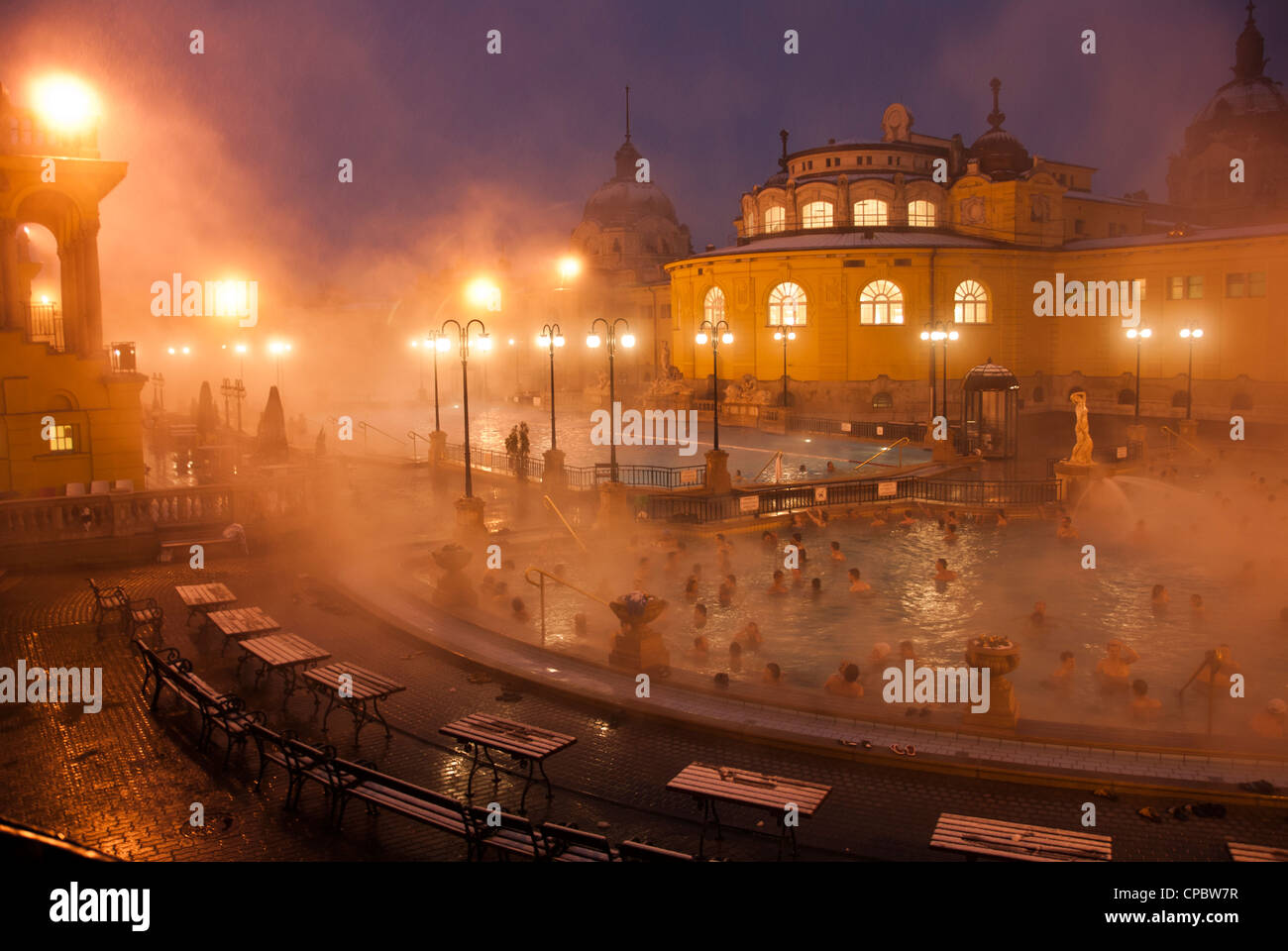 People enjoying the natural thermal waters at famous Szechenyi Baths ...