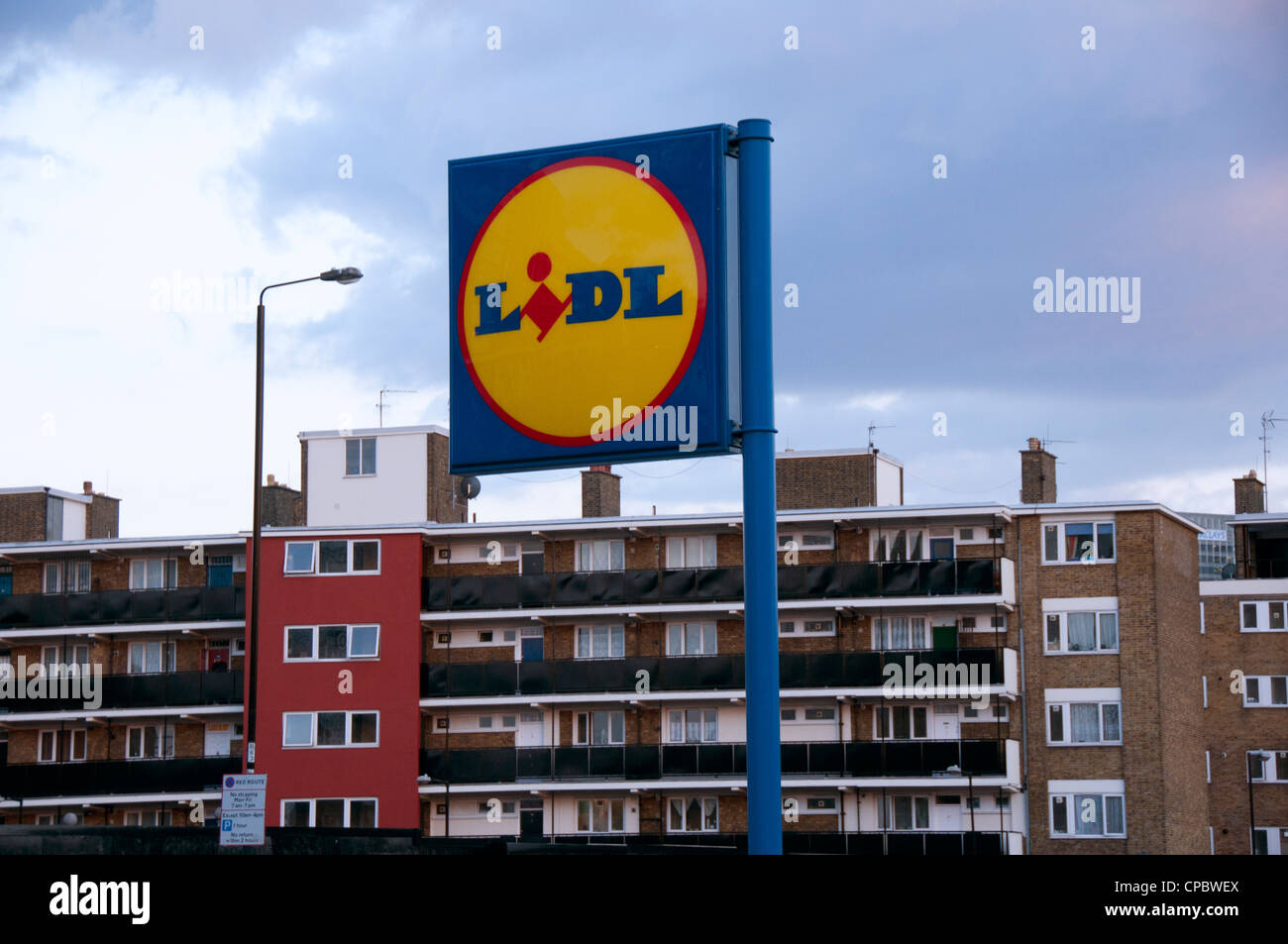 Lidl sign with council housing behind in East London Stock Photo - Alamy